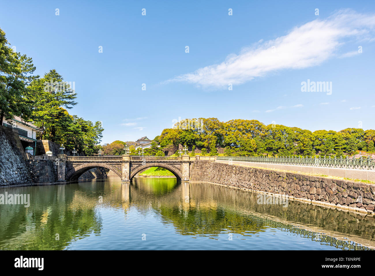 Tokyo, Japan reflection in pool moat by Imperial palace during spring ...
