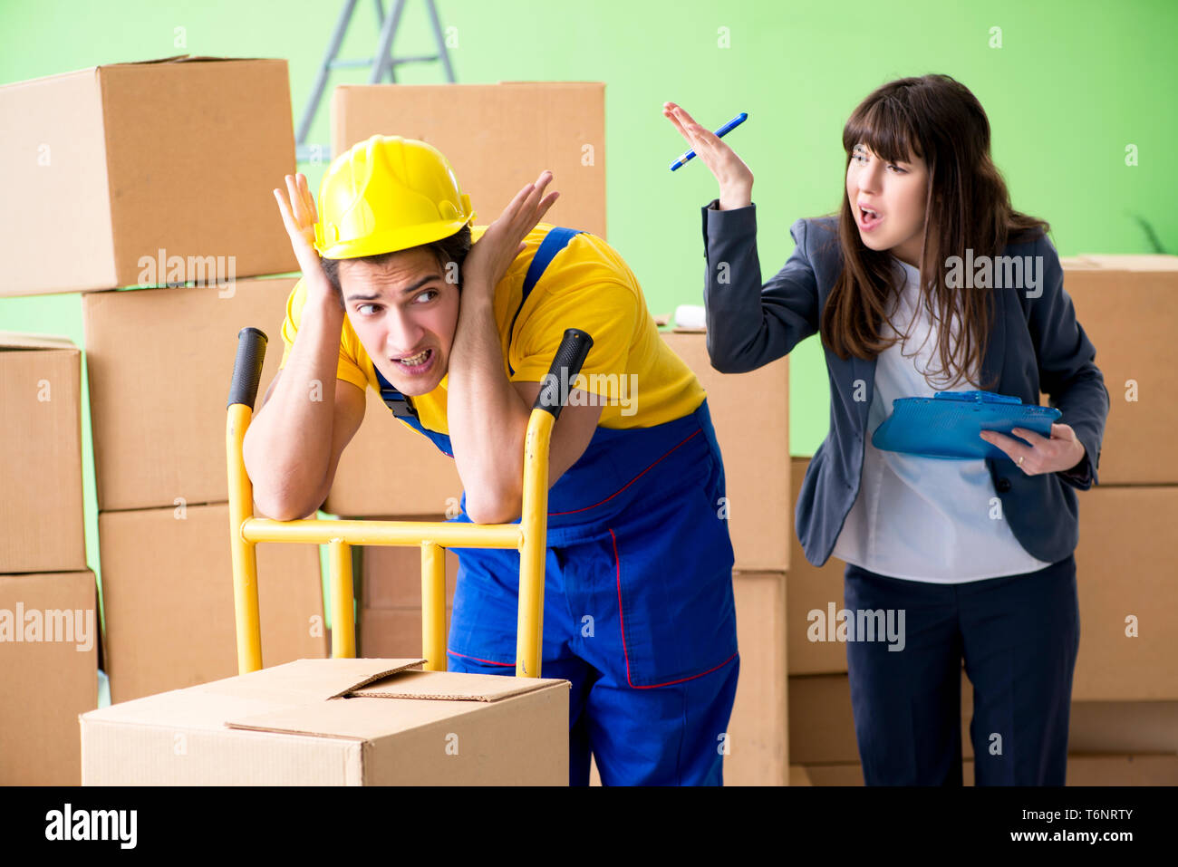 Woman boss and man contractor working with boxes delivery Stock Photo ...
