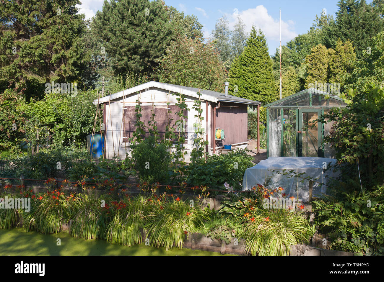 Garden house in a green environment Stock Photo - Alamy