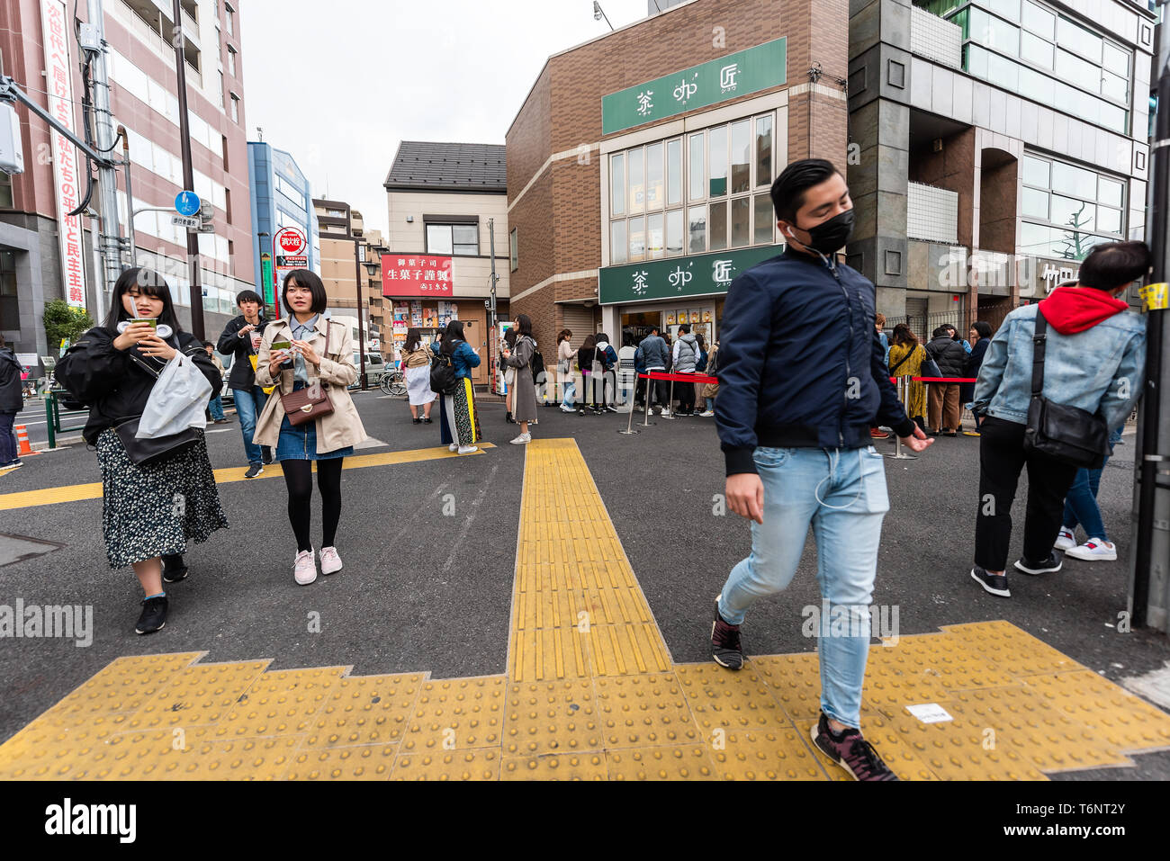 Tokyo, Japan - April 1, 2018: Shinjuku street with many people in ...