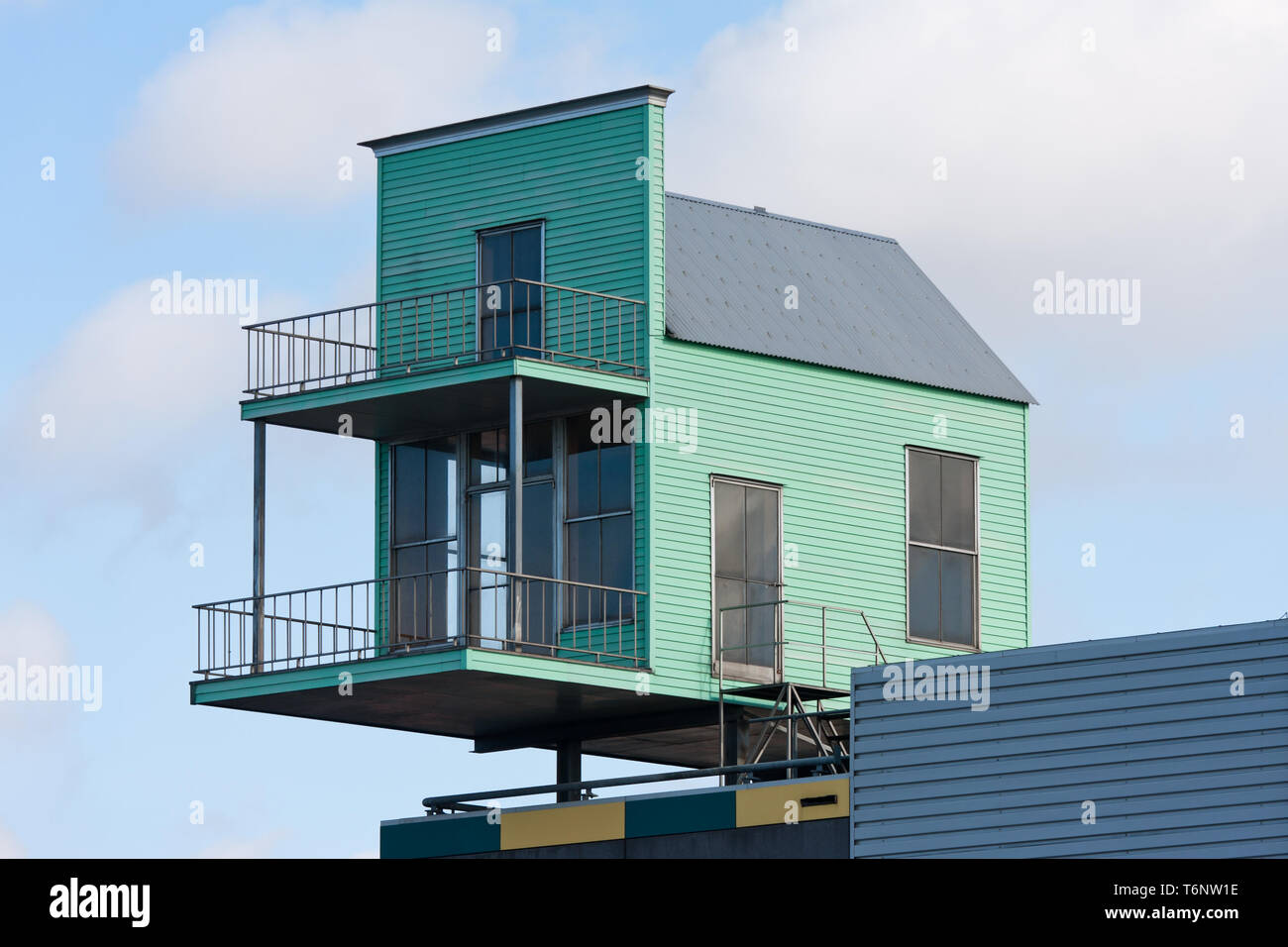 Little house at the top of a bigger building Stock Photo - Alamy