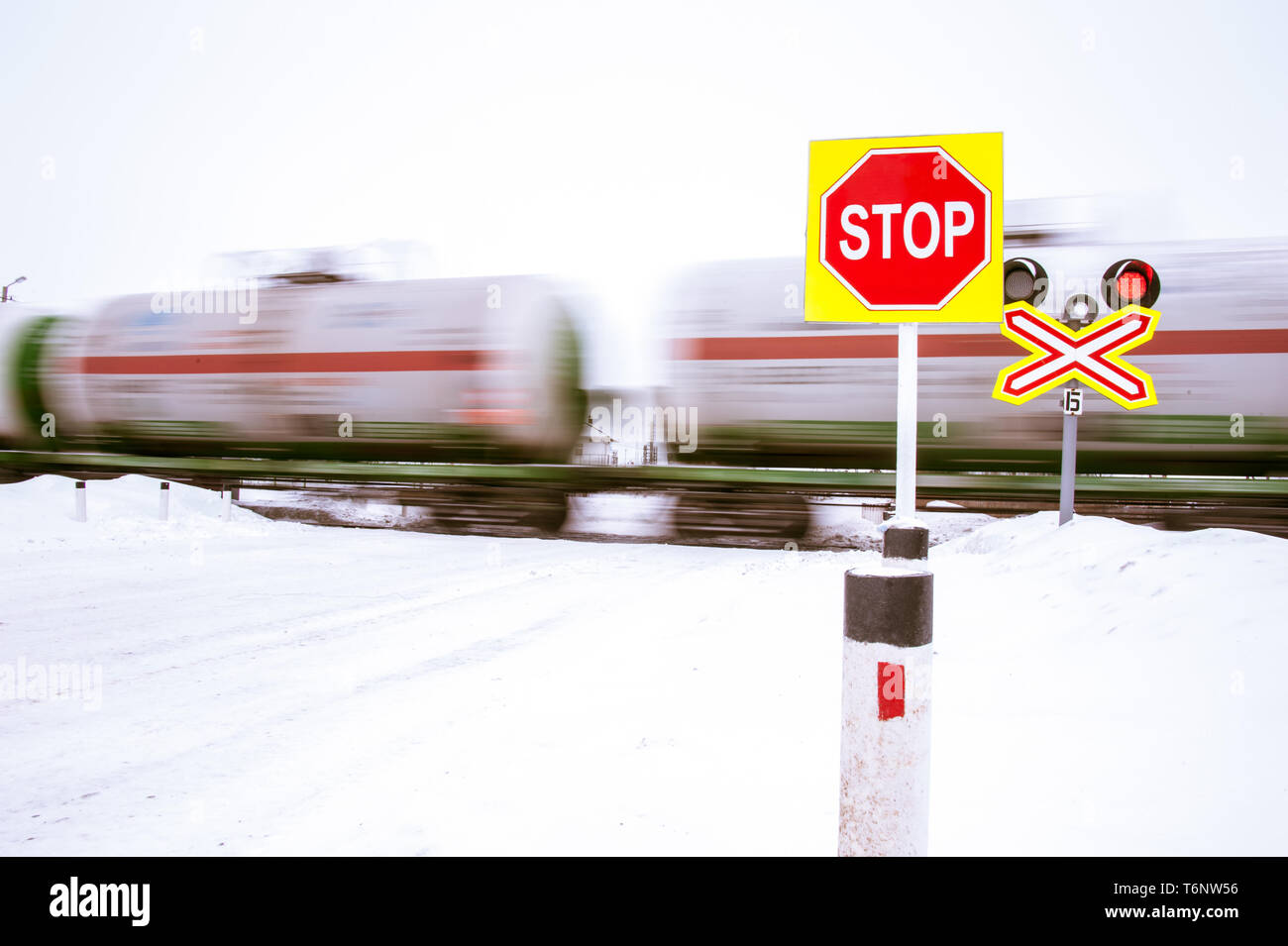 A stop sign at a railroad crossing Stock Photo - Alamy