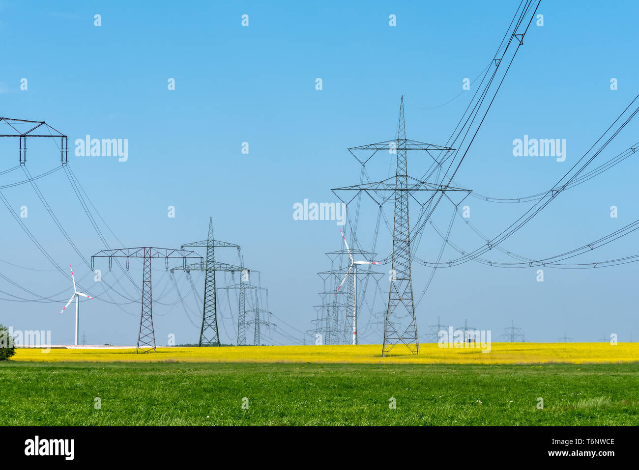 Overhead power lines in the fields seen in Germany Stock Photo - Alamy