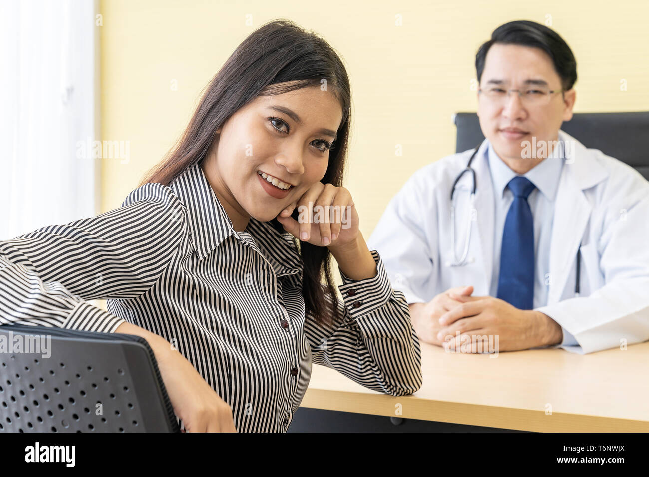 Patient in examination room medical office Stock Photo - Alamy