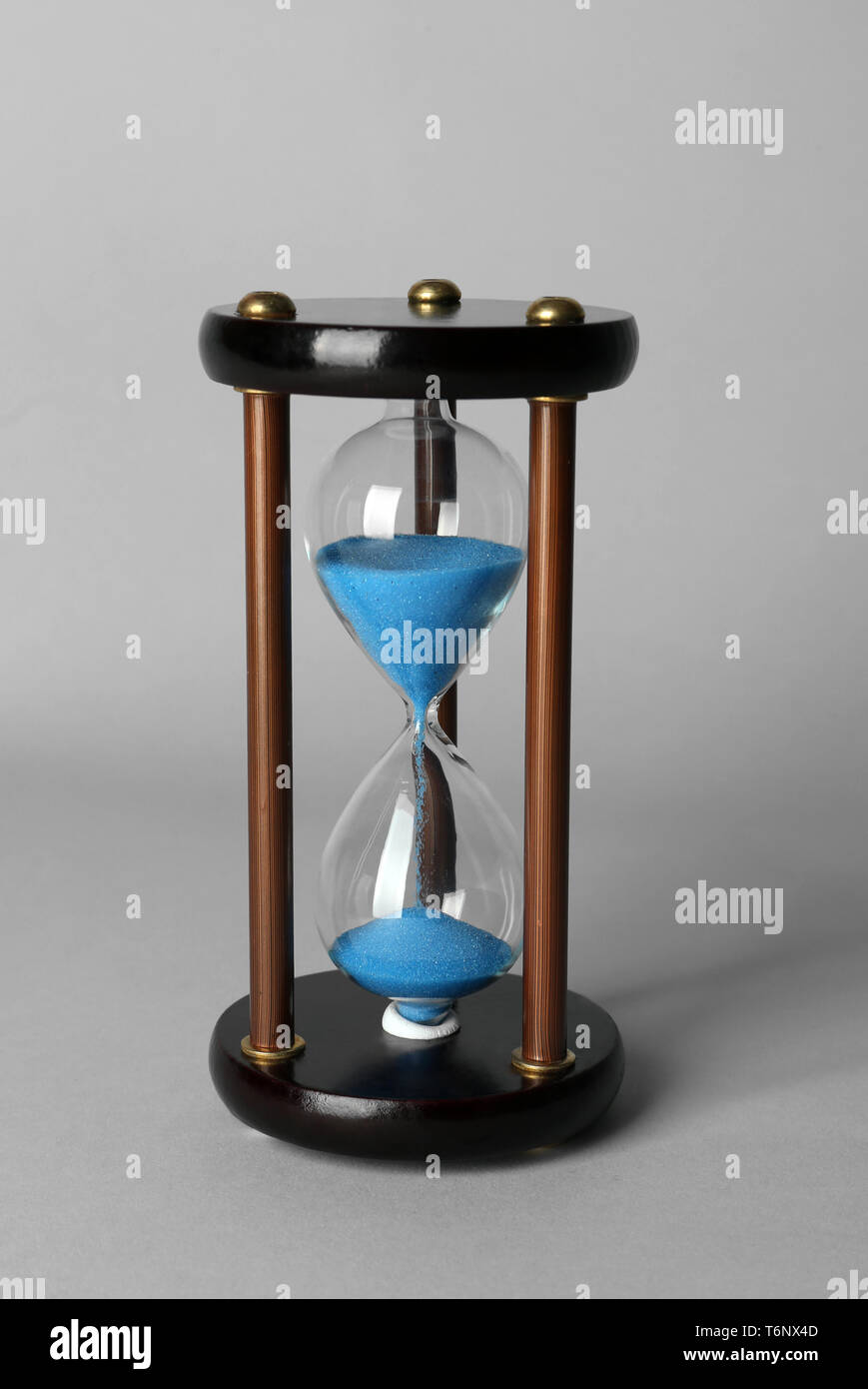 Hourglass on grey background. Time management concept Stock Photo - Alamy