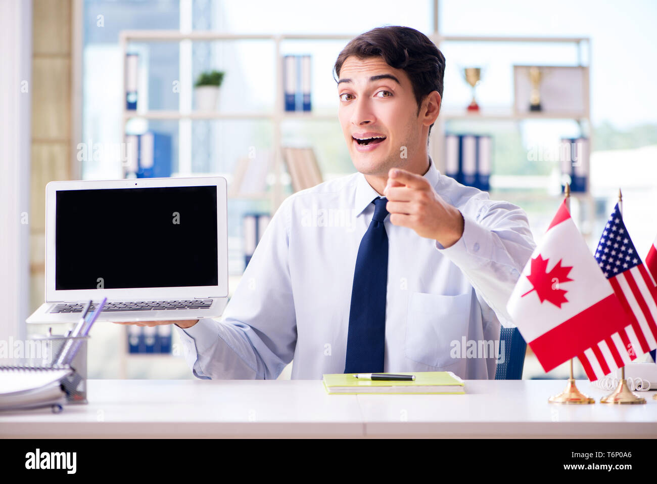 Sales agent working in travel agency Stock Photo - Alamy