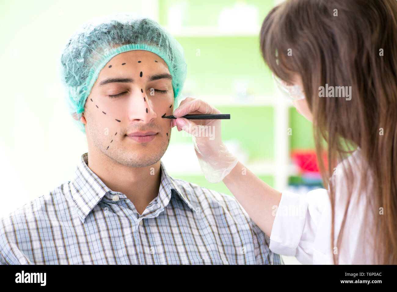 Plastic surgeon preparing for operation on man face Stock Photo - Alamy