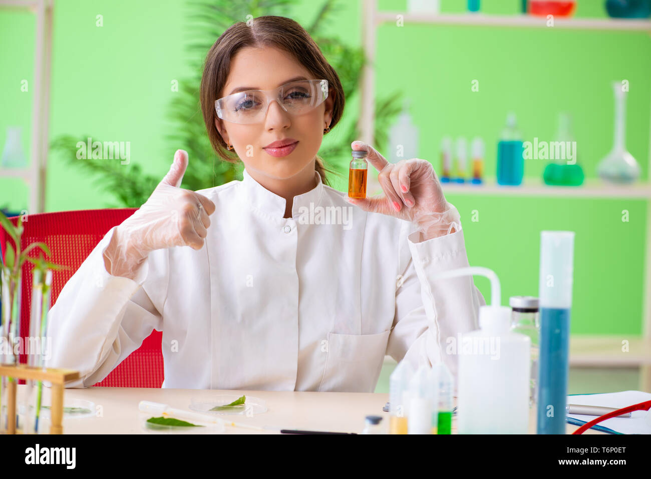 Female scientist analyzing liquid extract hi-res stock photography and ...