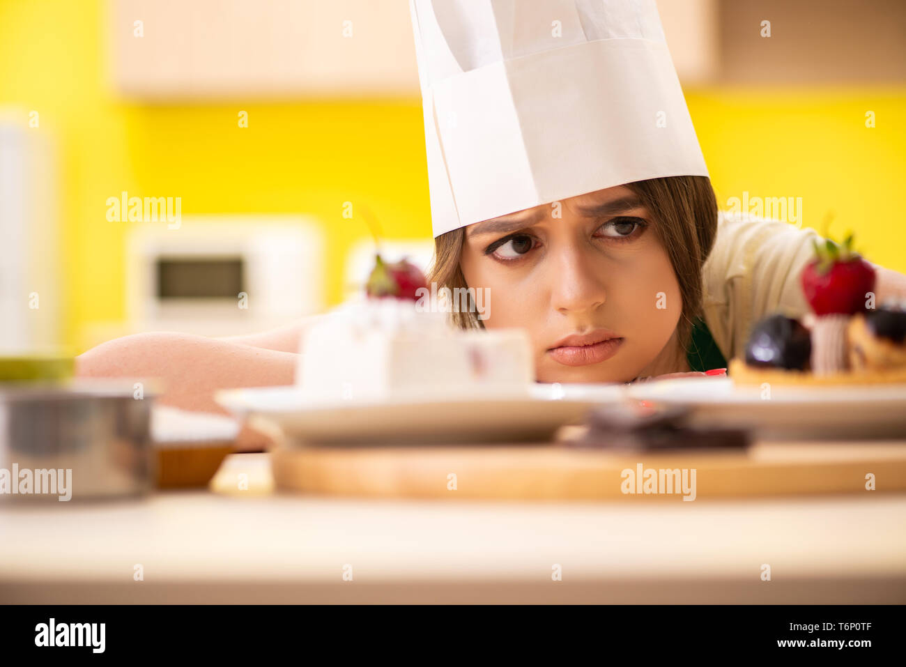 Young tired woman in cooking hi-res stock photography and images - Alamy