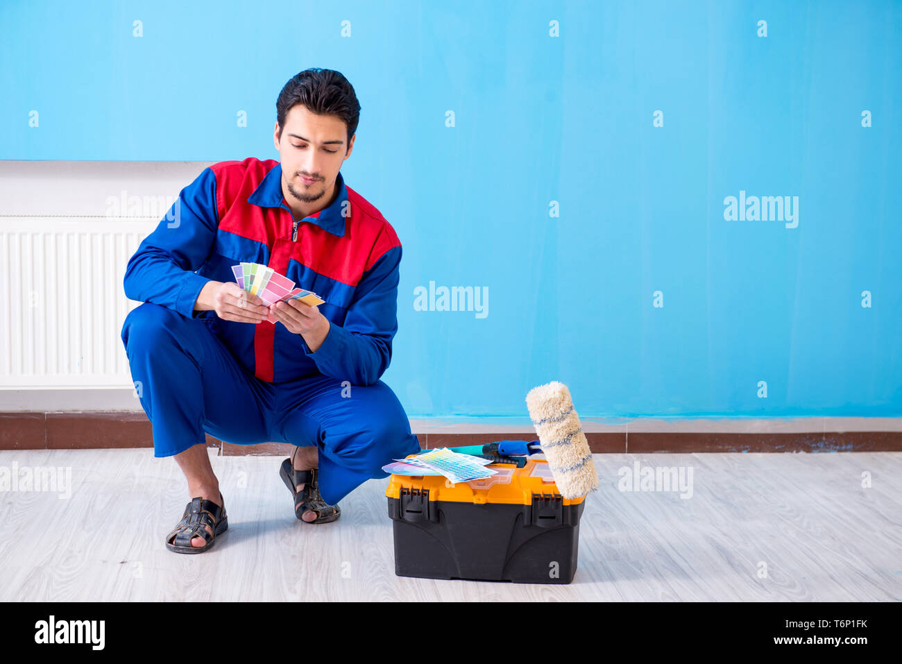 Young man doing home renovation Stock Photo - Alamy