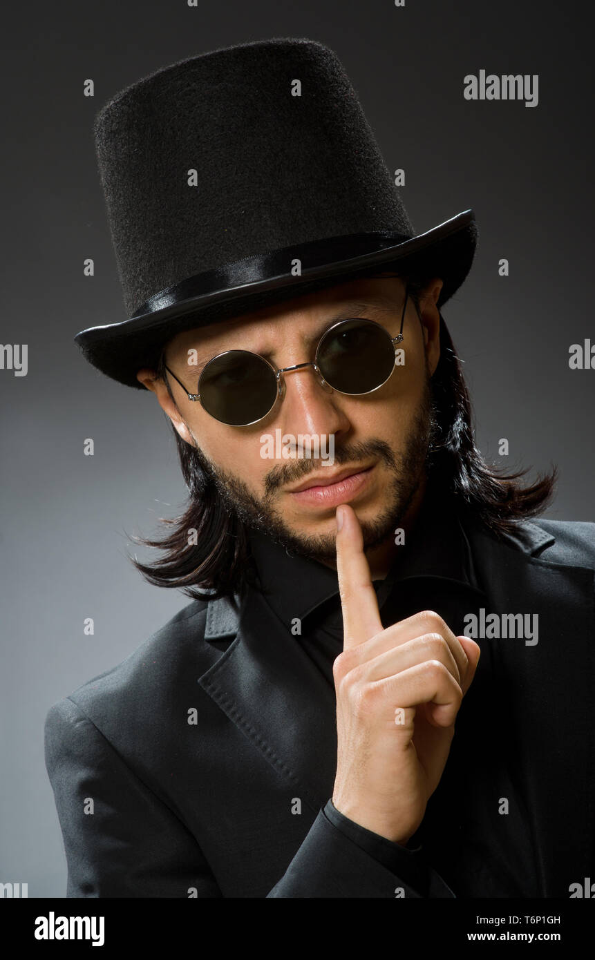 Vintage concept with man wearing black top hat Stock Photo - Alamy
