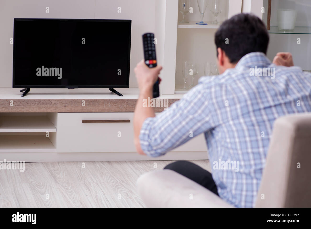 Back view young man switching hi-res stock photography and images - Alamy