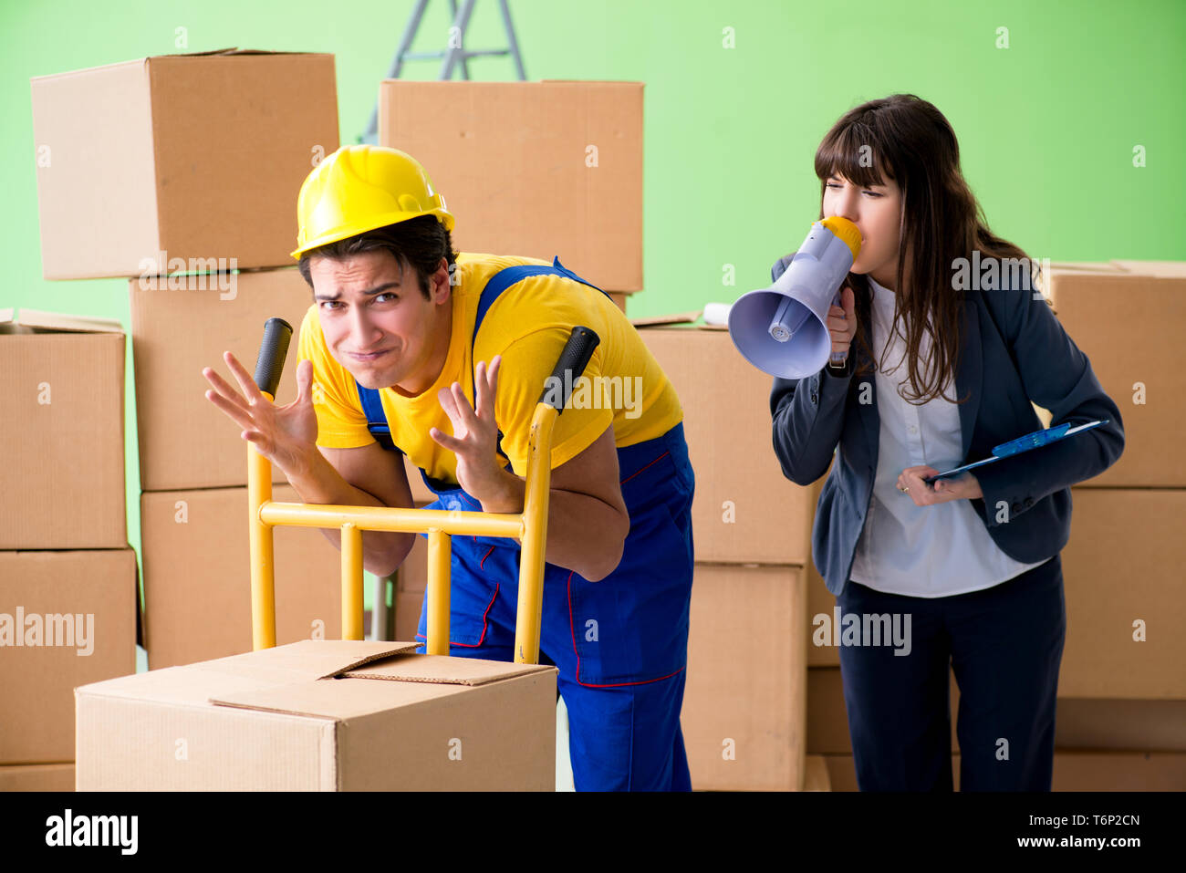 Woman boss and man contractor working with boxes delivery Stock Photo ...