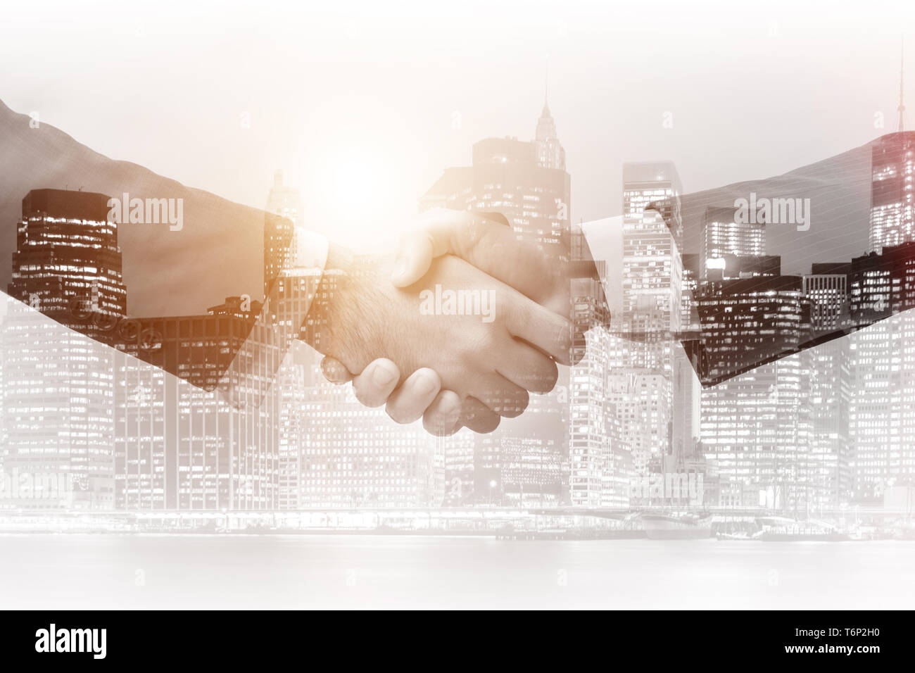 Concept of cooperation with handshake Stock Photo - Alamy