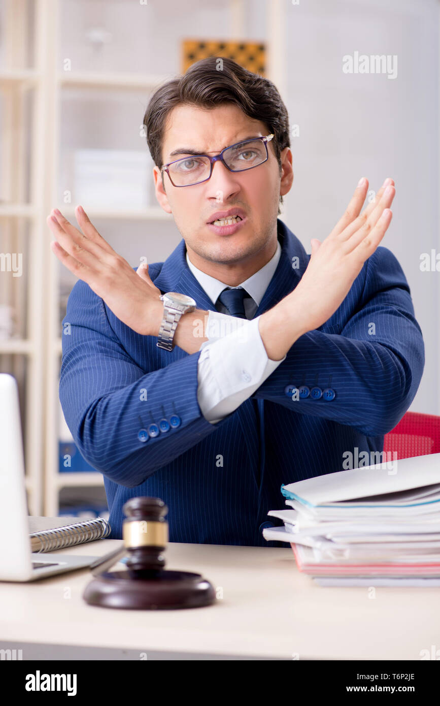 Young handsome judge working in court Stock Photo - Alamy