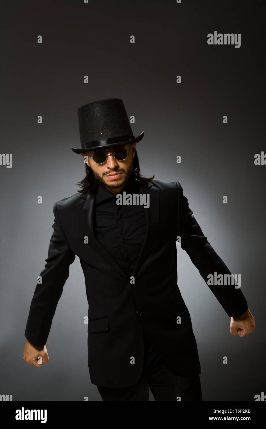Vintage concept with man wearing black top hat Stock Photo - Alamy