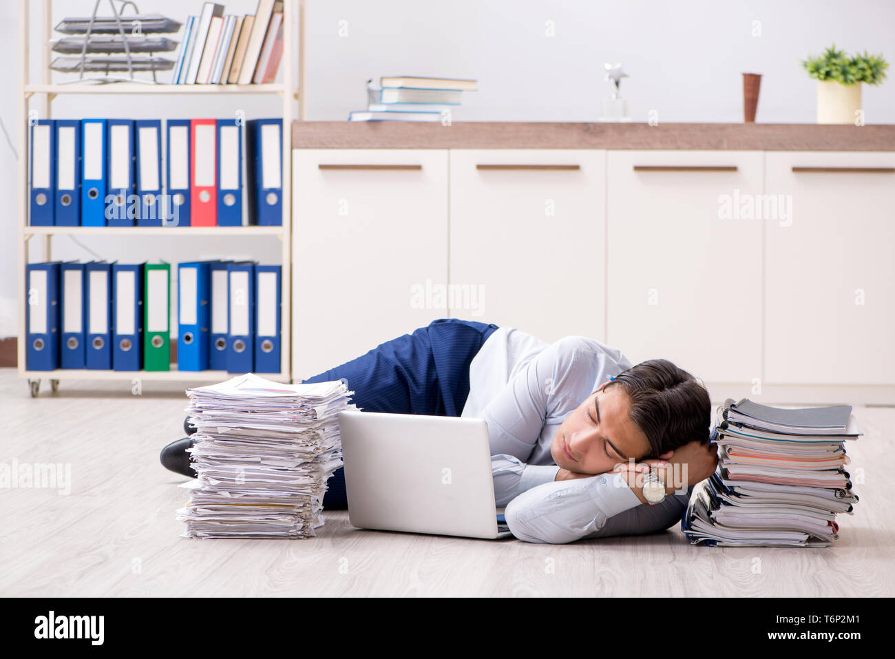 Extremely busy employee working in the office Stock Photo - Alamy