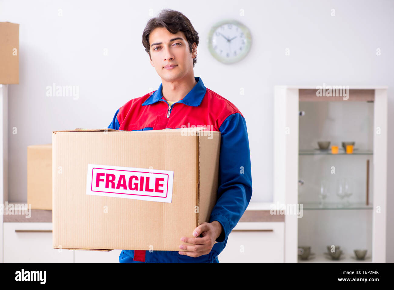 Transportation contractor with fragile boxes Stock Photo - Alamy