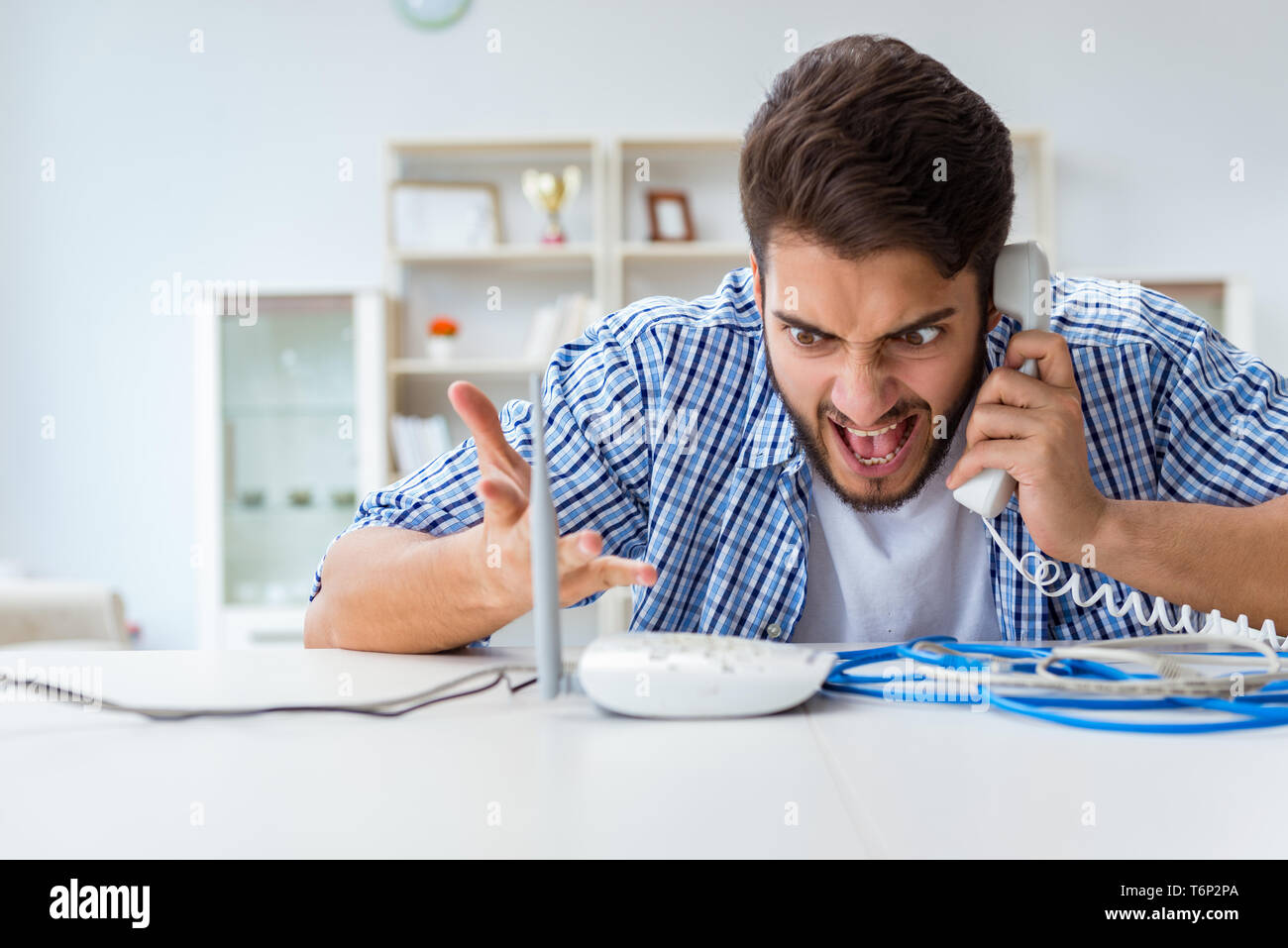 Frustrated young man due to weak internet reception Stock Photo - Alamy