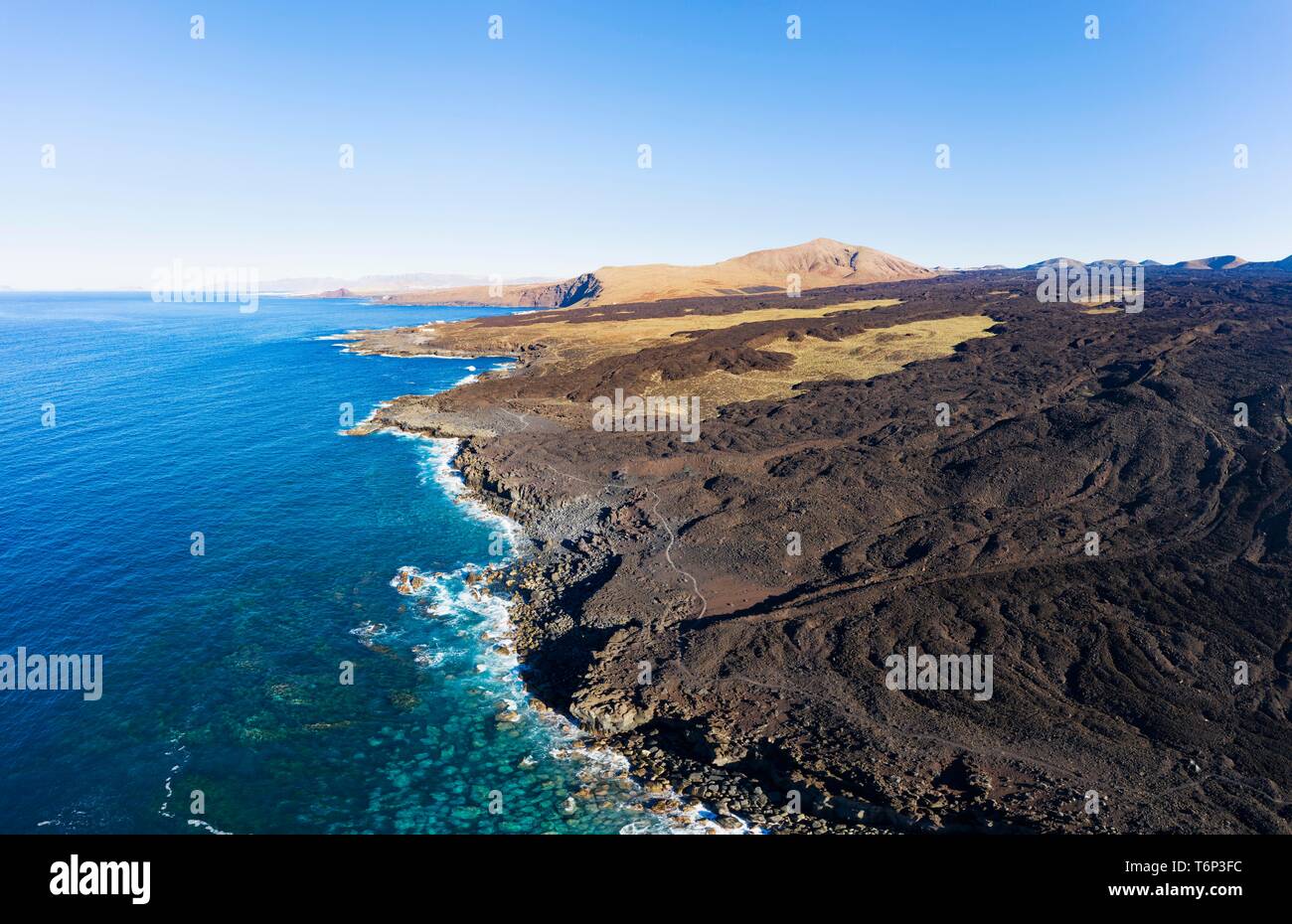 Lava coast, Los Volcanes nature park Park, Tenezar settlement, Montana ...