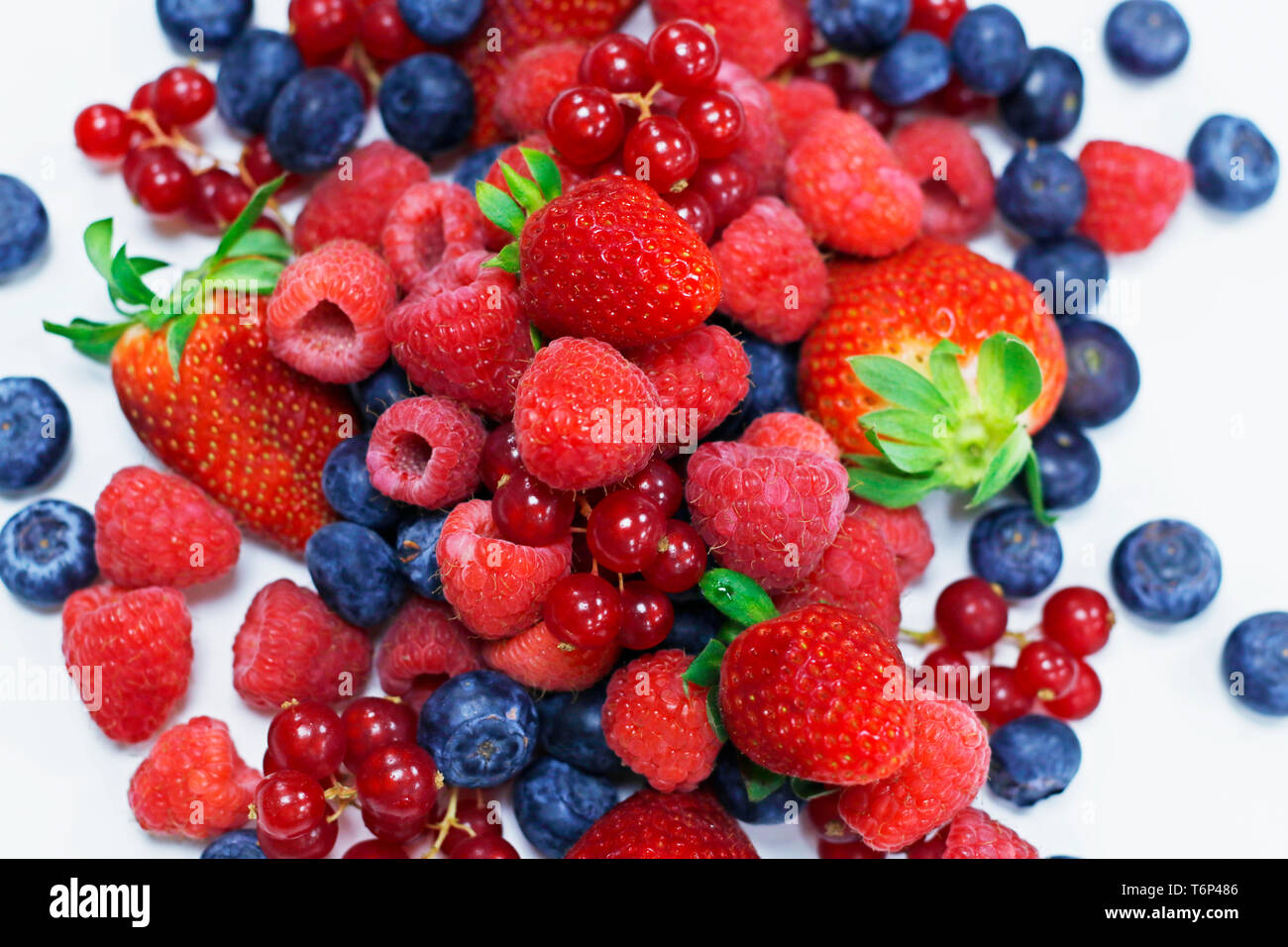 assorted fresh berries with white background Stock Photo - Alamy