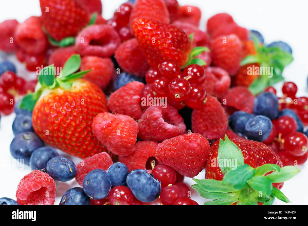 assorted fresh berries with white background Stock Photo - Alamy