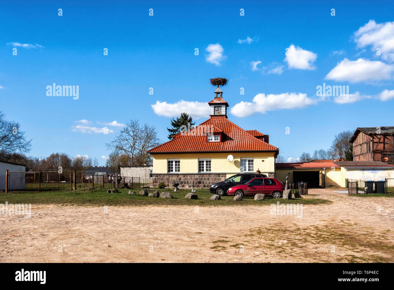Stork nest on clock turret of house in Milmersdorf, Brandenburg ...