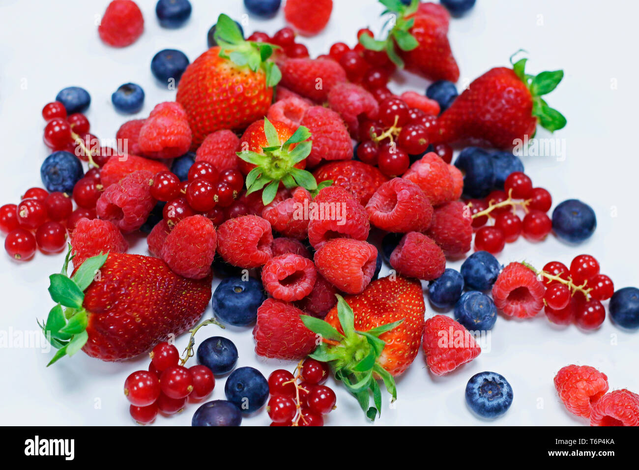 assorted fresh berries with white background Stock Photo - Alamy
