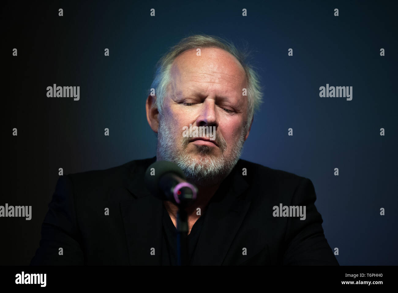 Munich, Germany. 02nd May, 2019. Axel Milberg, actor, sits on stage ...