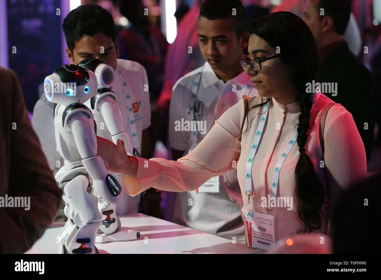 Dubai, United Arab Emirates. 1st May, 2019. Visitors look at robots ...