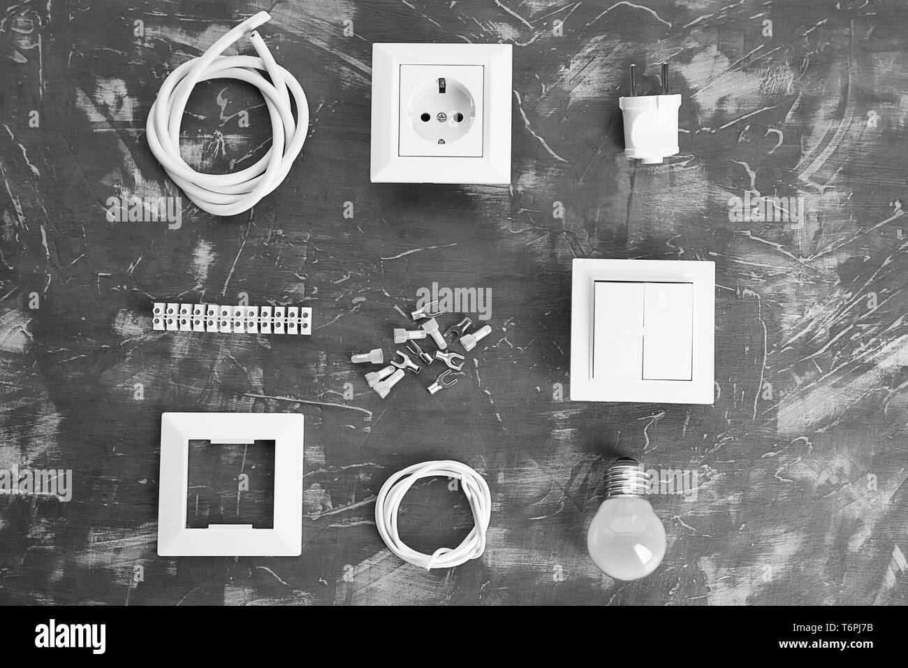 Flat lay composition with electrical outlet, switch and light bulb on ...