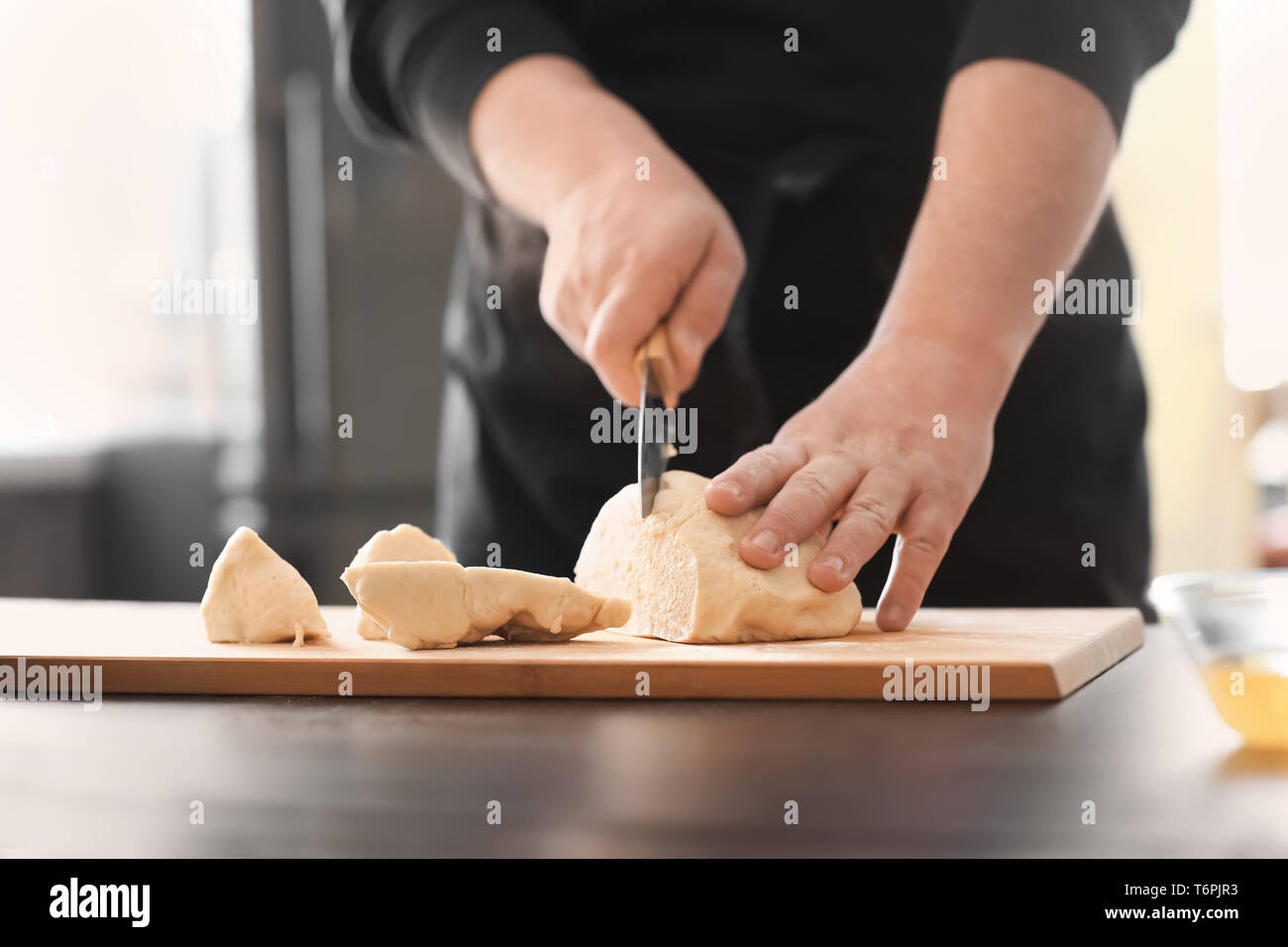 Baker cutting hi-res stock photography and images - Alamy