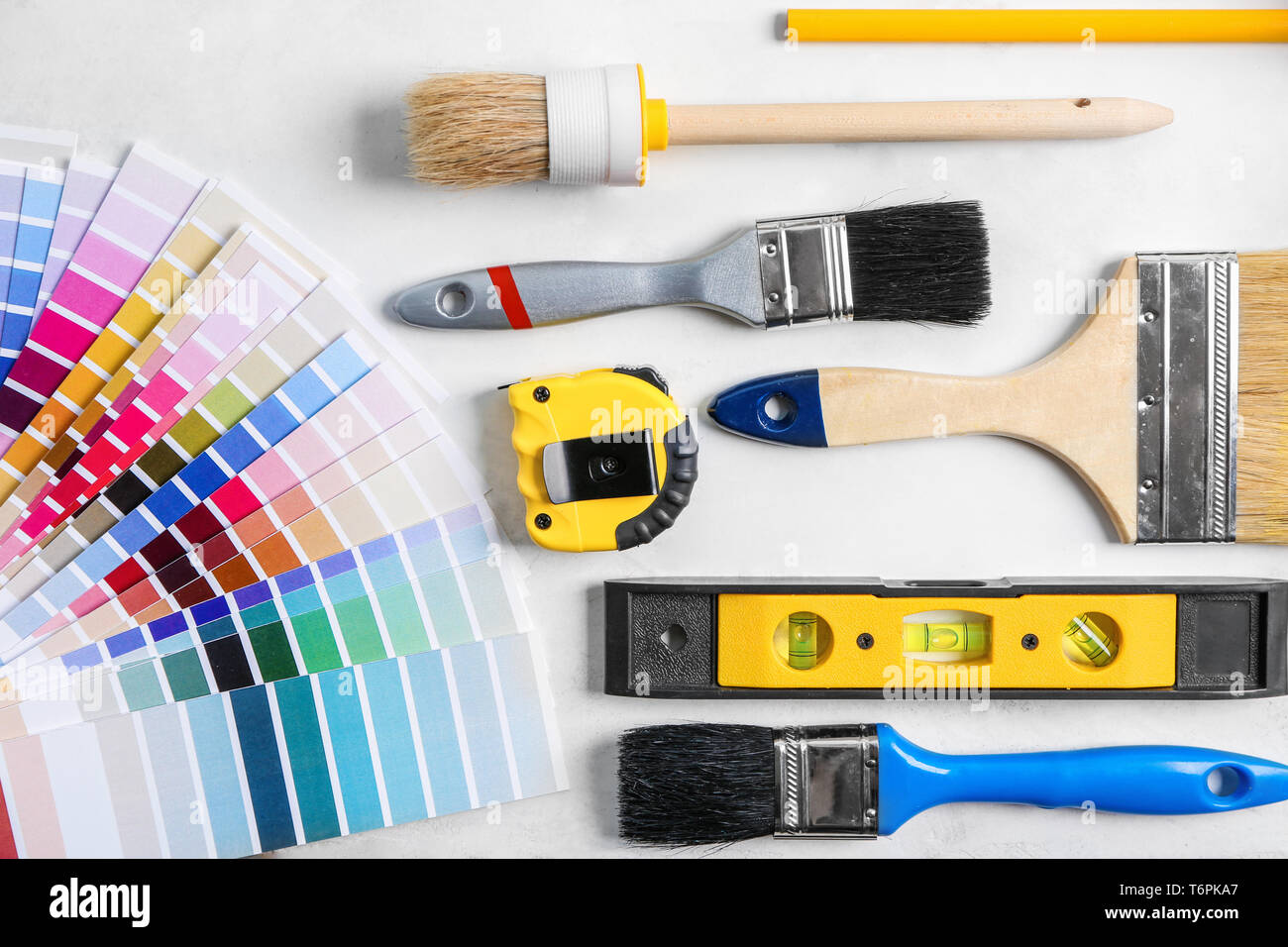Set of painter's tools on light background Stock Photo - Alamy