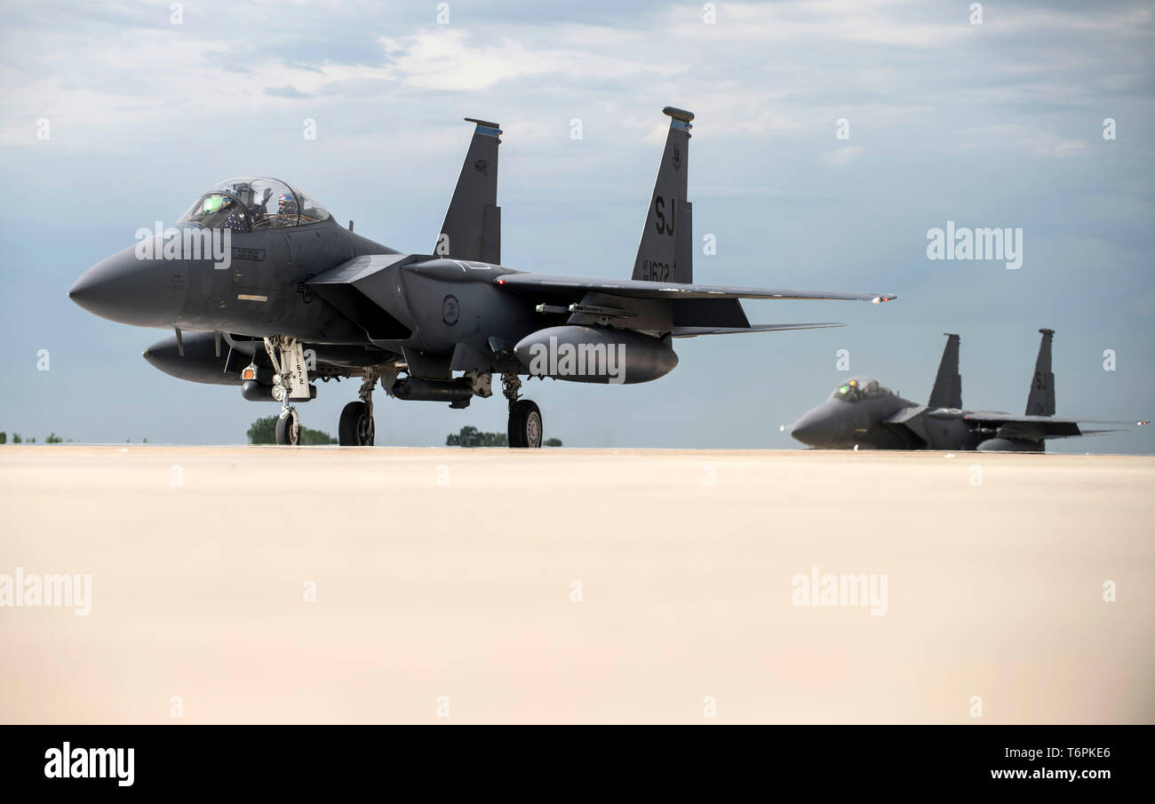 Two F-15E Strike Eagles taxi during the Wings Over Wayne Air Show ...