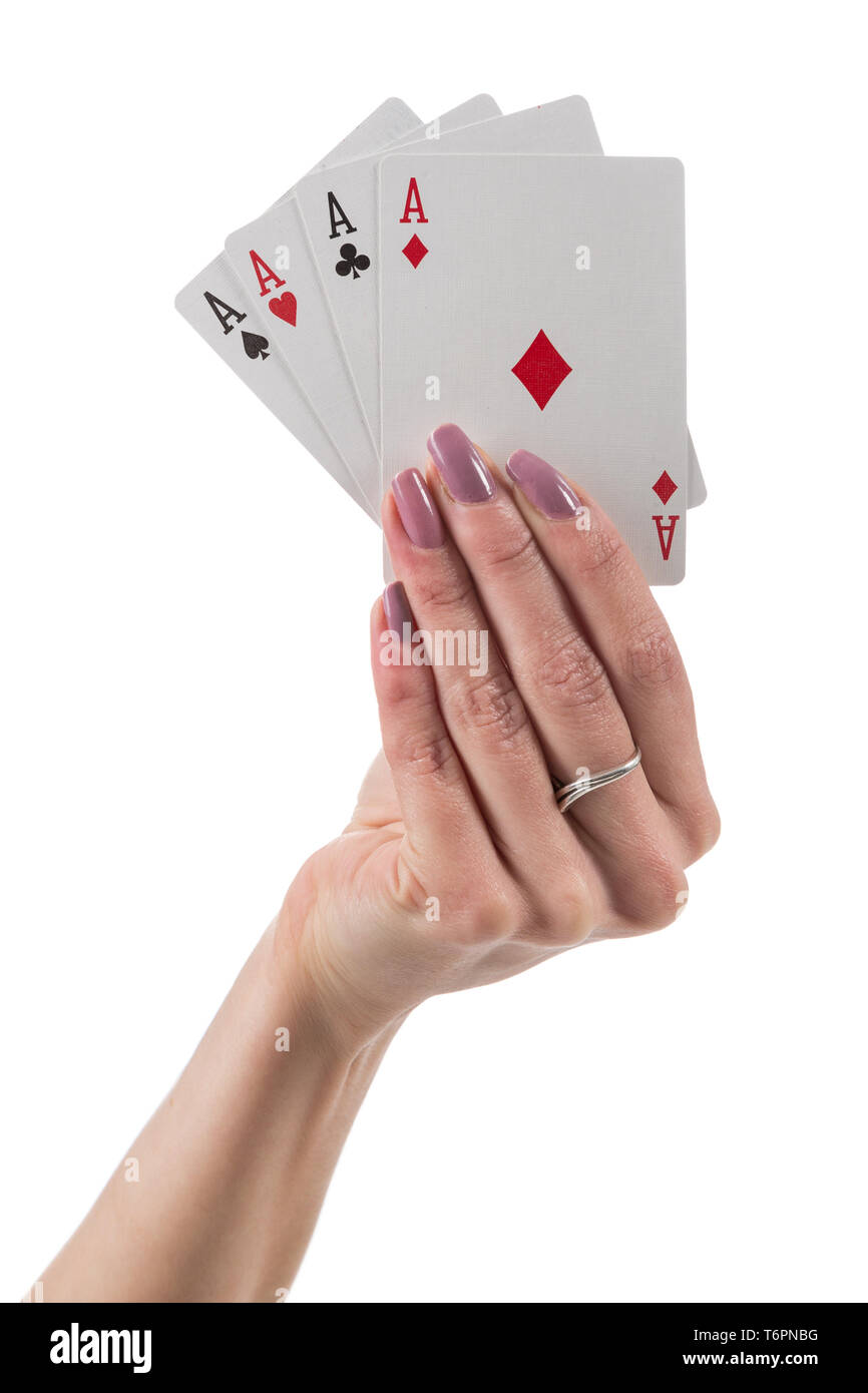 Female hand showing four aces cards isolated over white background ...