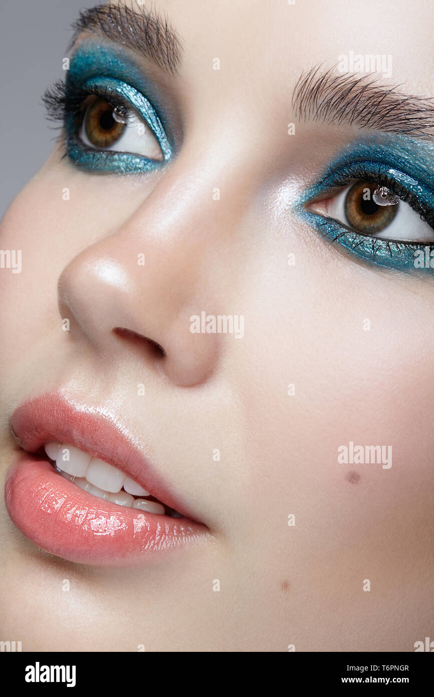 Closeup macro portrait of female face. Woman with evening beauty makeup ...