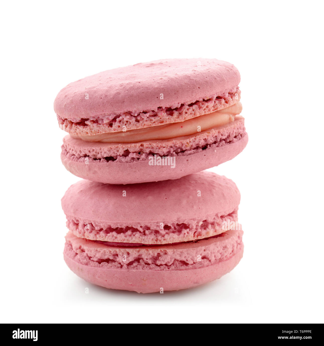 Delicious pink macarons on white background Stock Photo - Alamy
