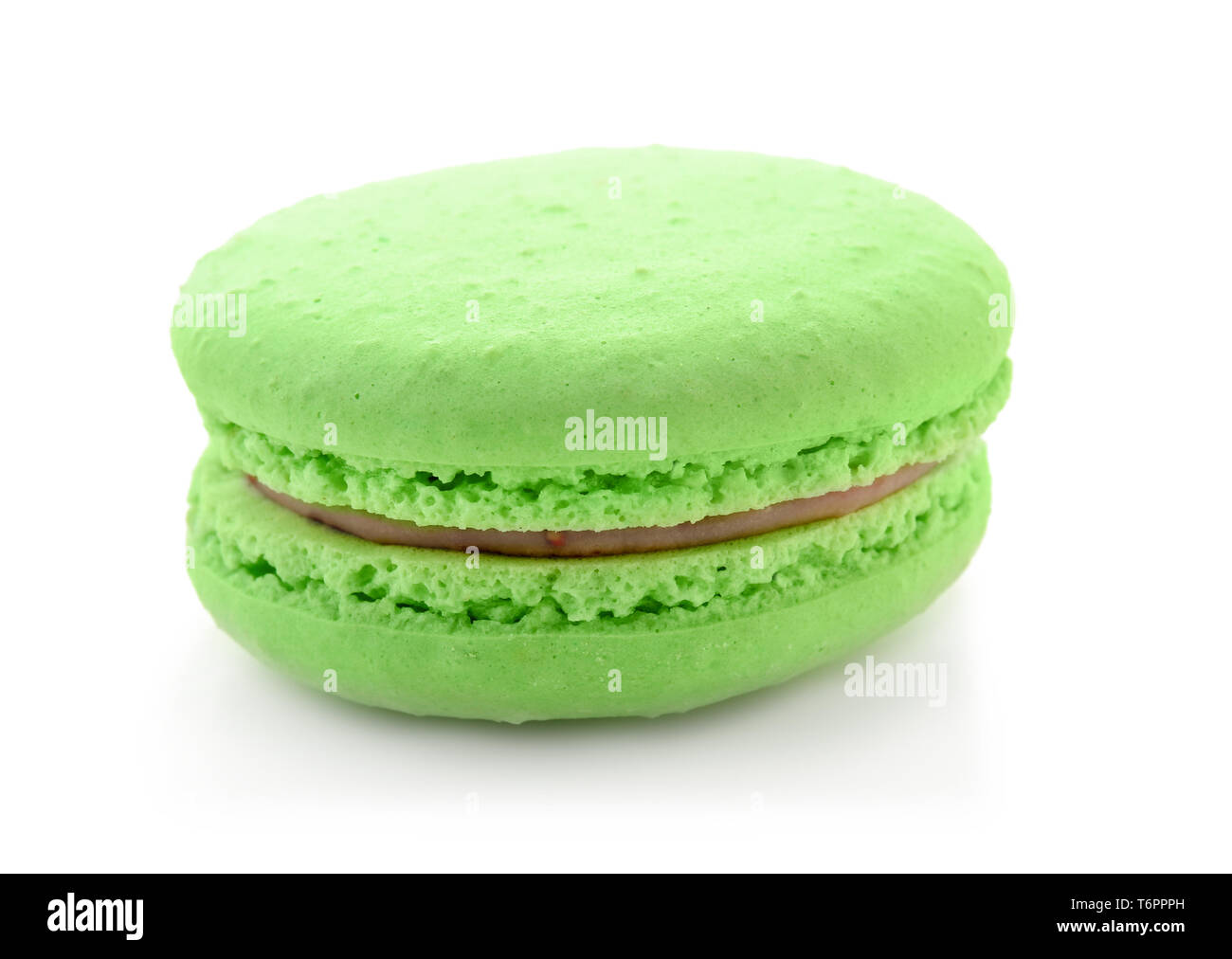 Delicious green macaron on white background Stock Photo - Alamy
