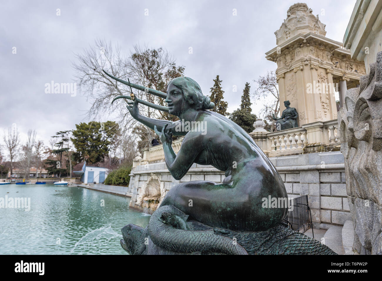 Bronze sculpture of mermaid over pond in front of Monument to Alfonso ...