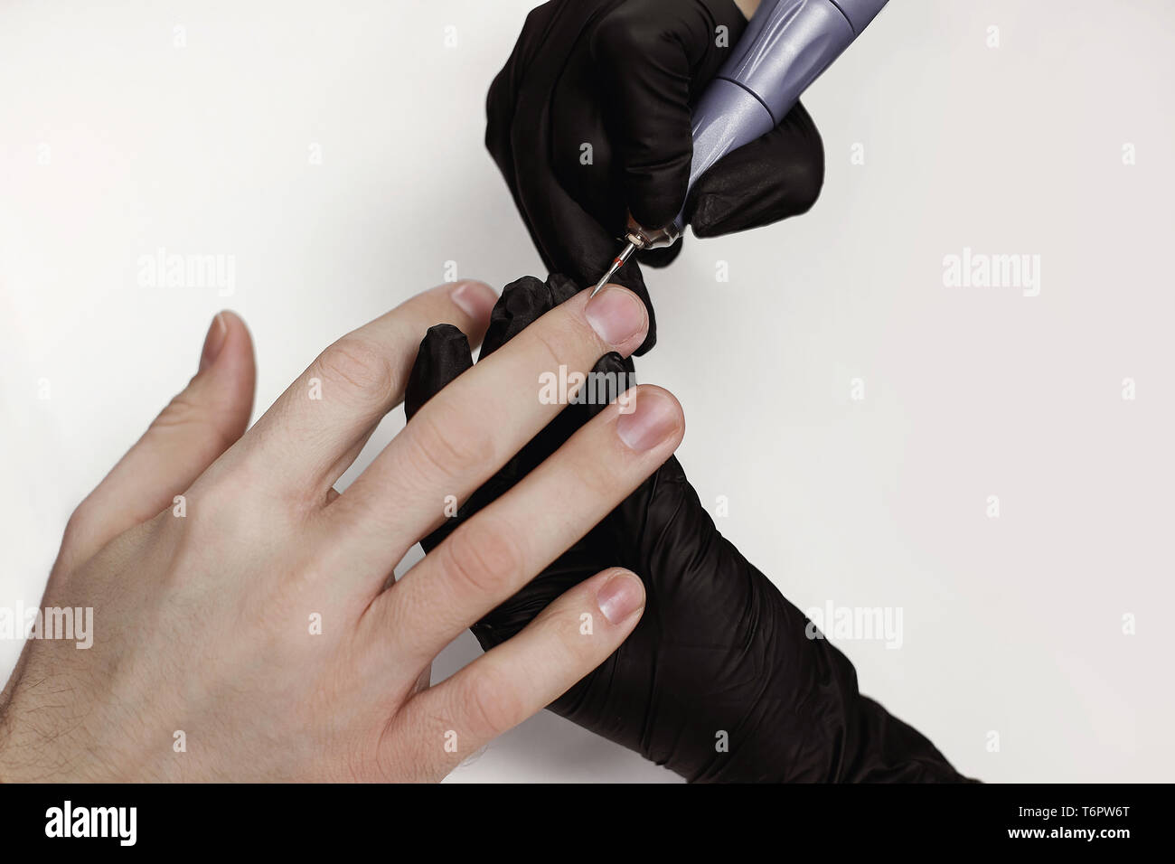 The man on procedures in manicure salon. Spa, manicuring, the master ...