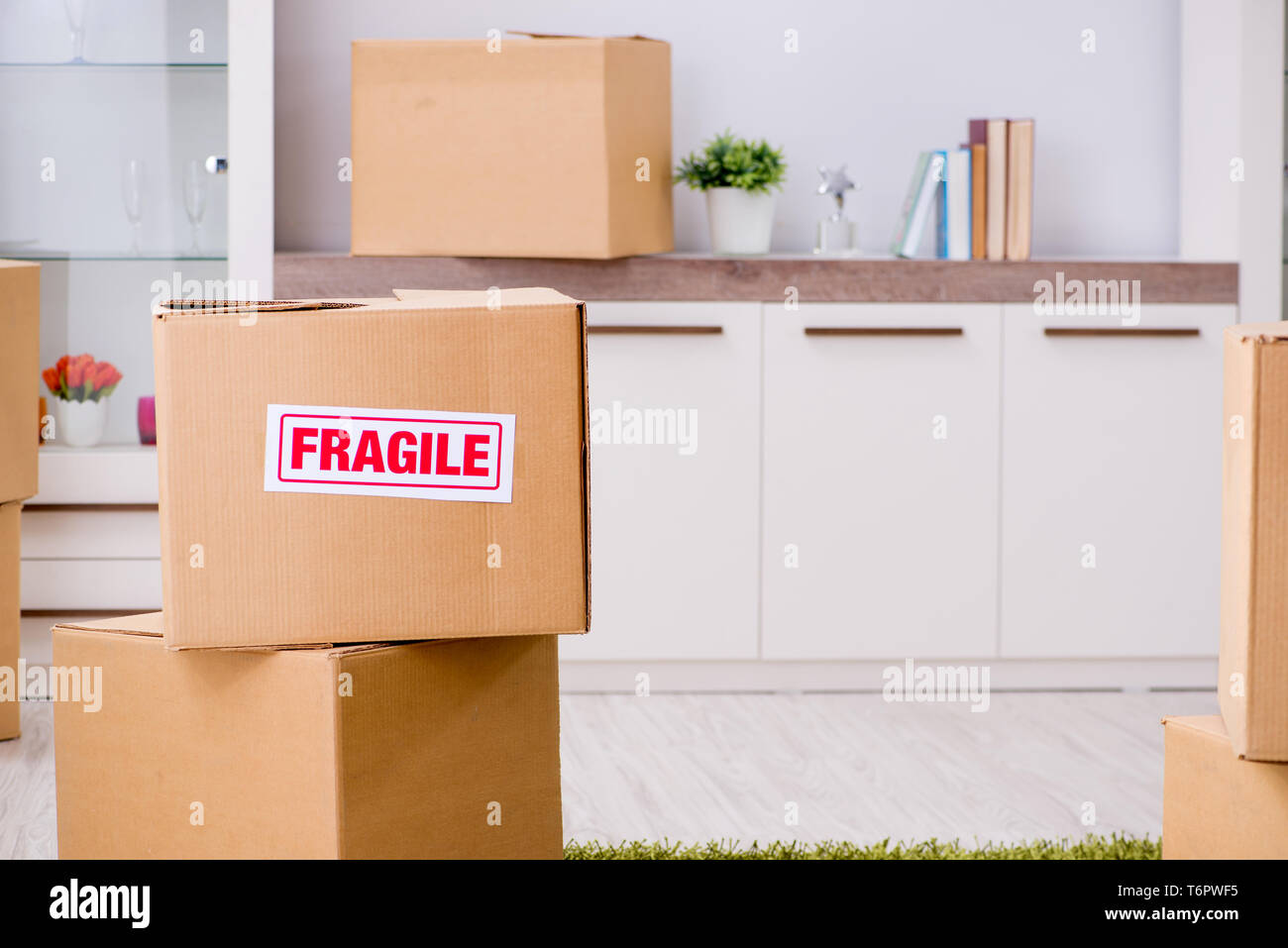 Man moving house and relocating with fragile items Stock Photo - Alamy