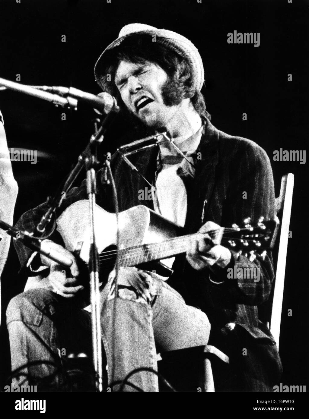 London - August: Neil Young performs live on stage with members CSN+Y ...