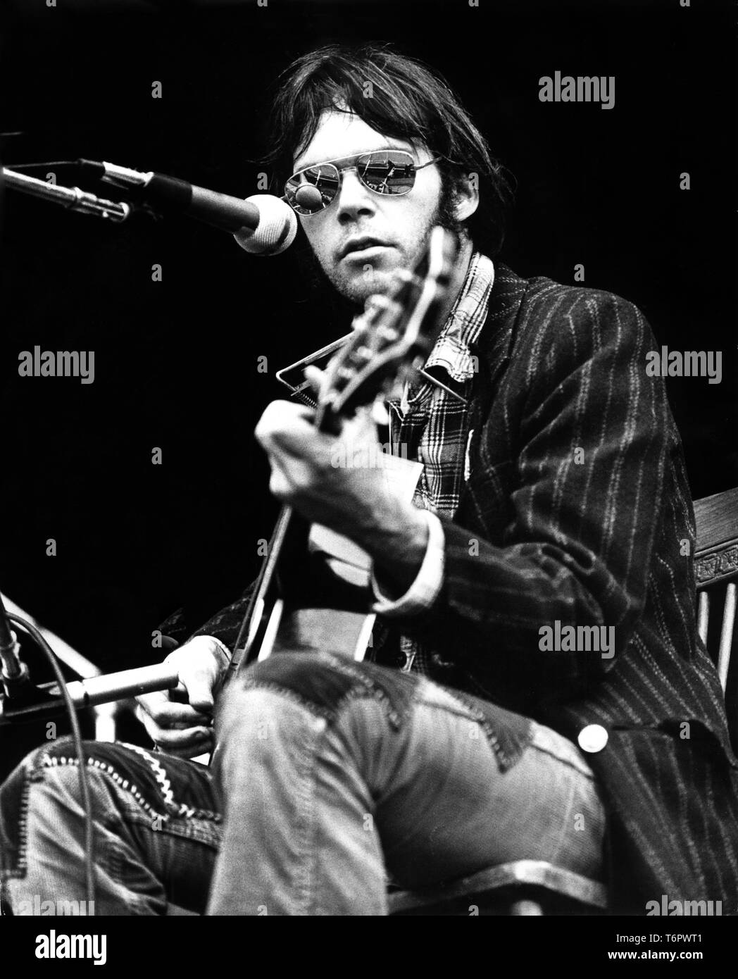 London - August: Neil Young performs live on stage with members CSN+Y ...