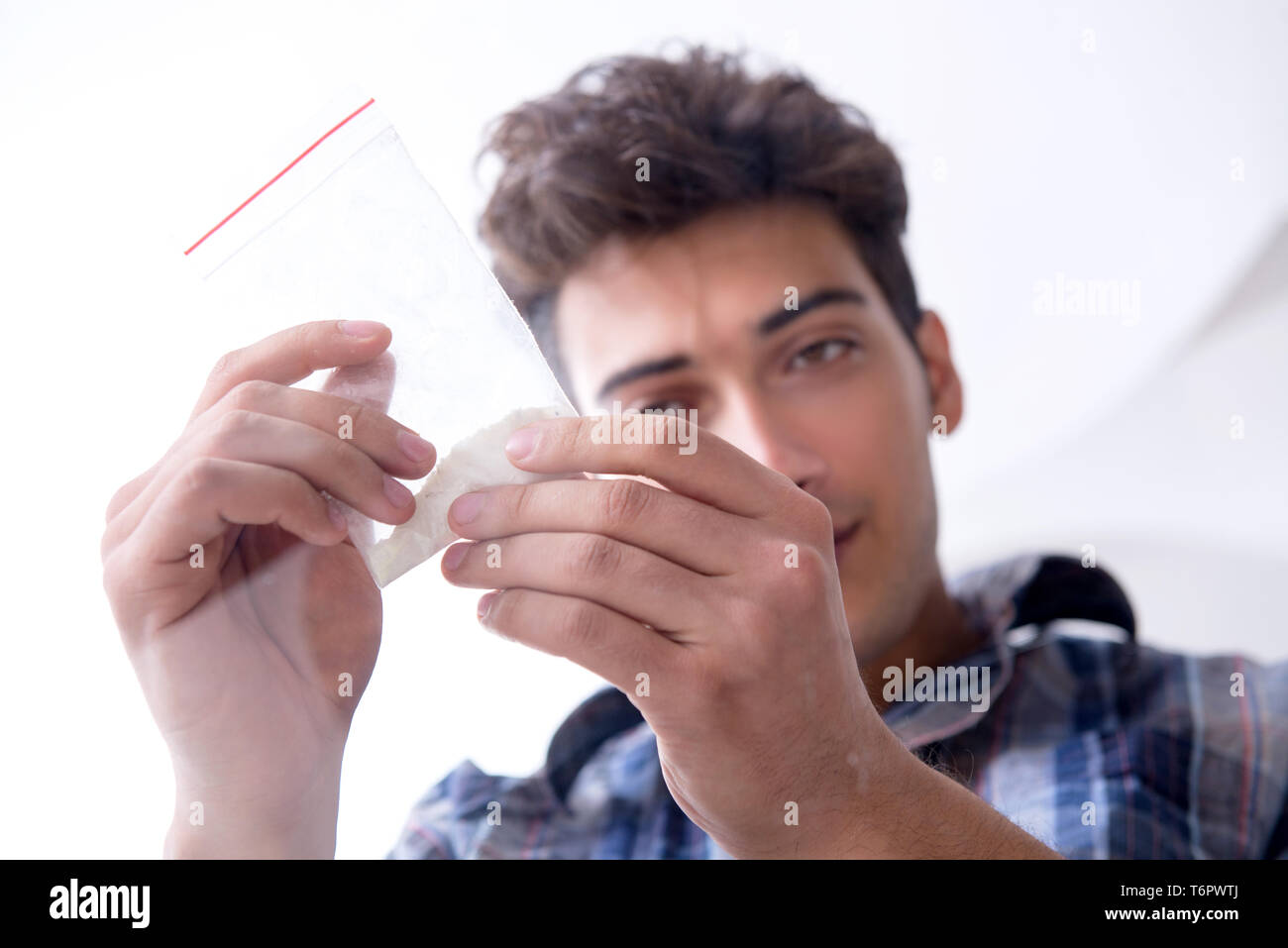 Drug addict sniffing cocaine narcotic Stock Photo - Alamy