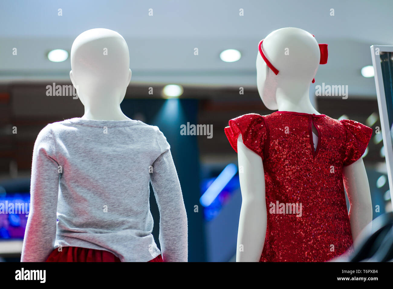 Fashion Kids on statue in clouth Stock Photo - Alamy