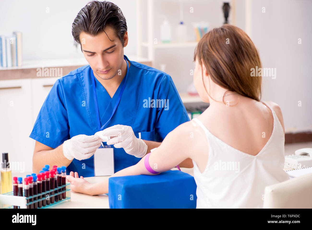 Young patient during blood test sampling procedure Stock Photo - Alamy