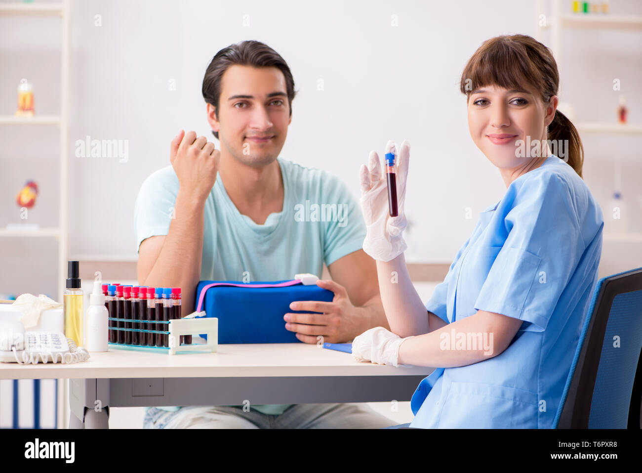 Young patient during blood test sampling procedure Stock Photo - Alamy