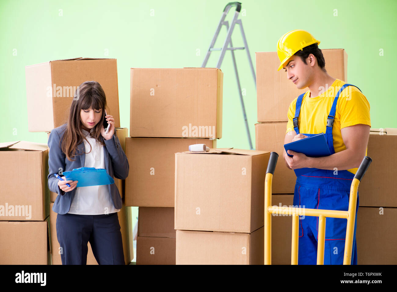 Woman boss and man contractor working with boxes delivery Stock Photo ...