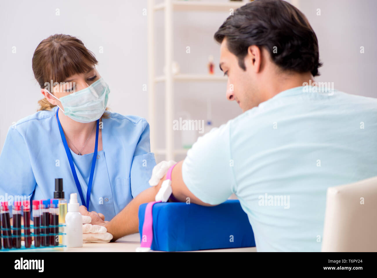 Young patient during blood test sampling procedure Stock Photo - Alamy