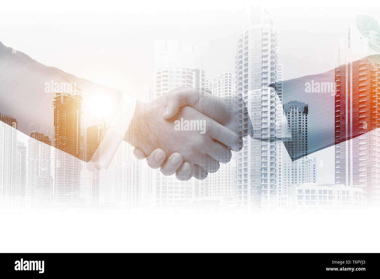 Concept of cooperation with handshake Stock Photo - Alamy